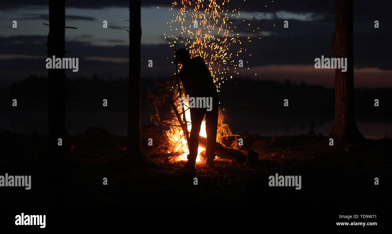 Man near fire night hi-res stock photography and images - Alamy