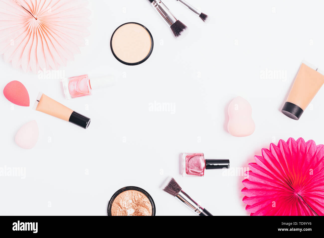 Festive makeup background of powders, sponges and brushes on white ...