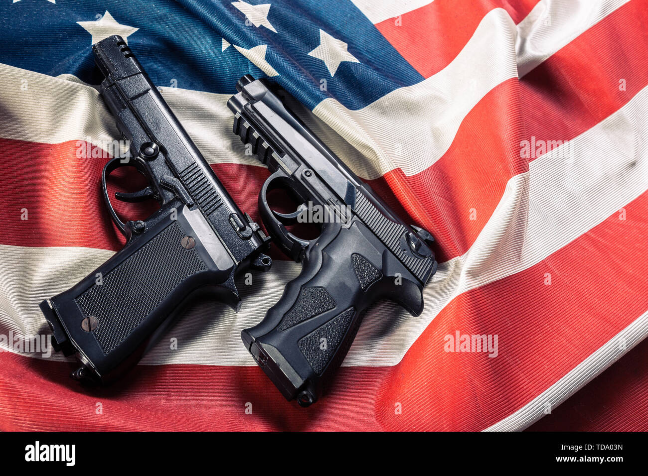 Handgun lying on American flag Stock Photo - Alamy