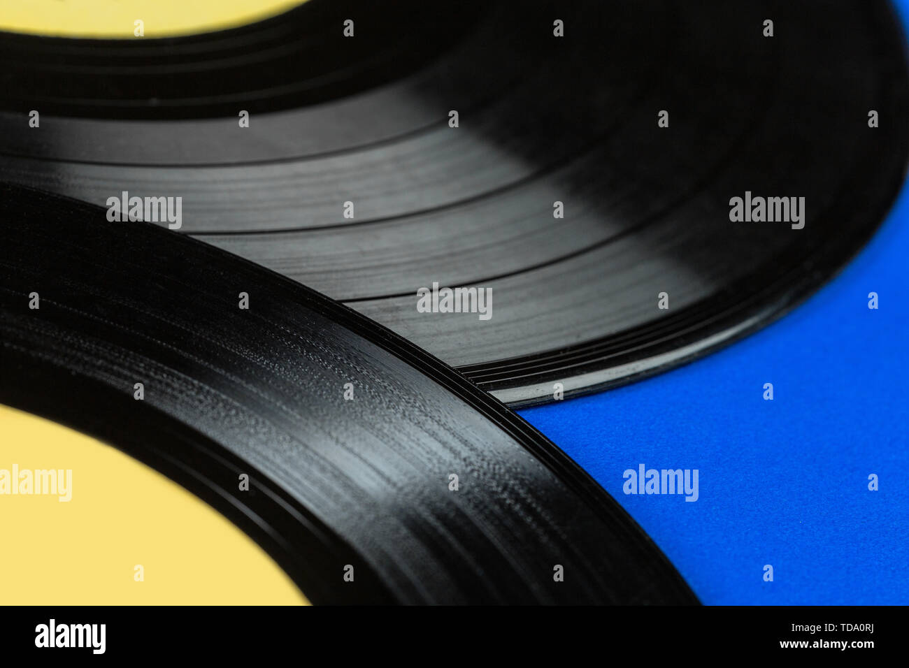 Retro vinyl record on blue background Stock Photo - Alamy