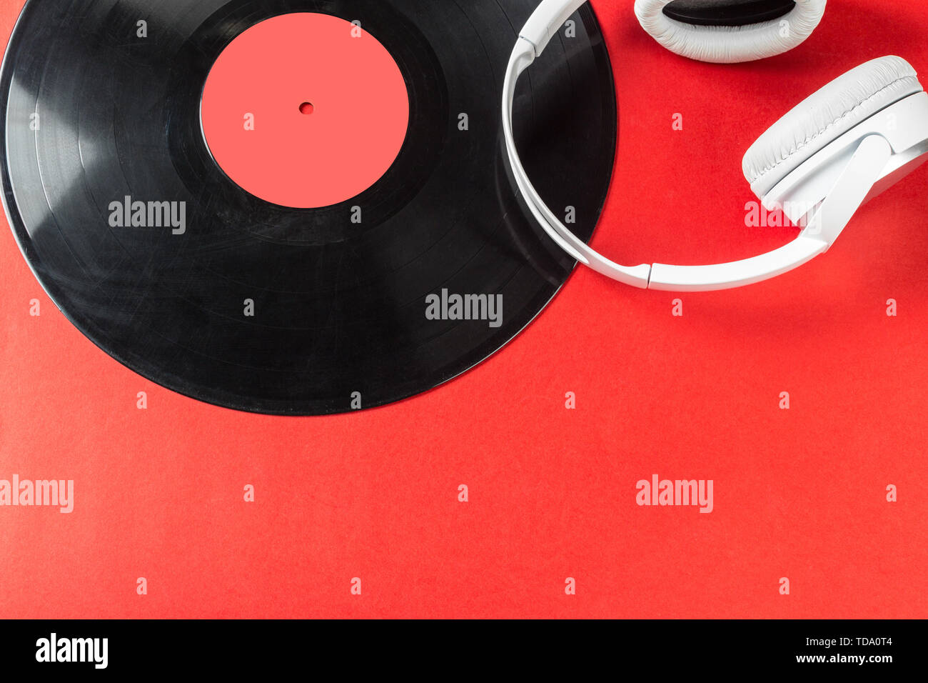 record on a red background Stock Photo - Alamy