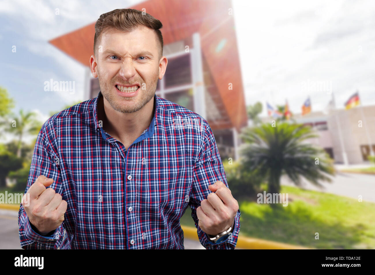 Portrait Of Angry Young Man Stock Photo - Alamy