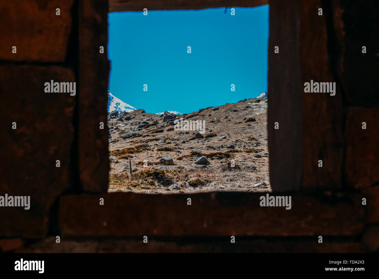photo of an empty window with an exit on a mountain view Stock Photo ...