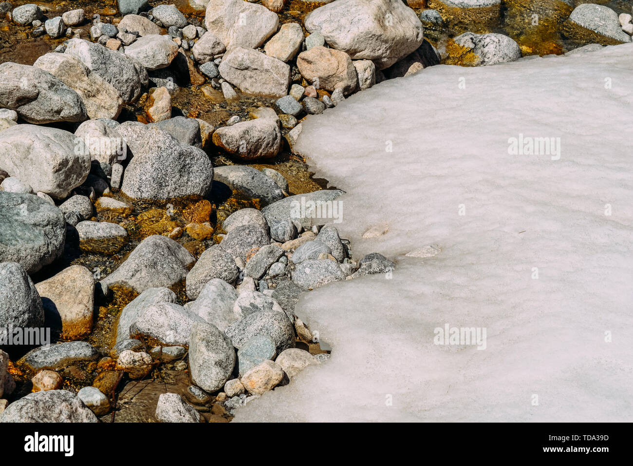 stones and snow in the highlands in the daytime Stock Photo - Alamy