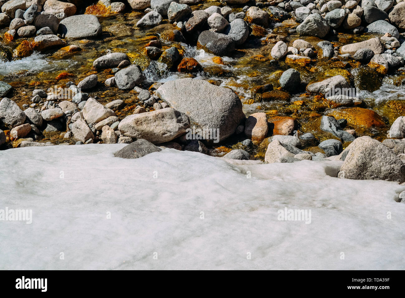 stones and snow in the highlands in the daytime Stock Photo - Alamy