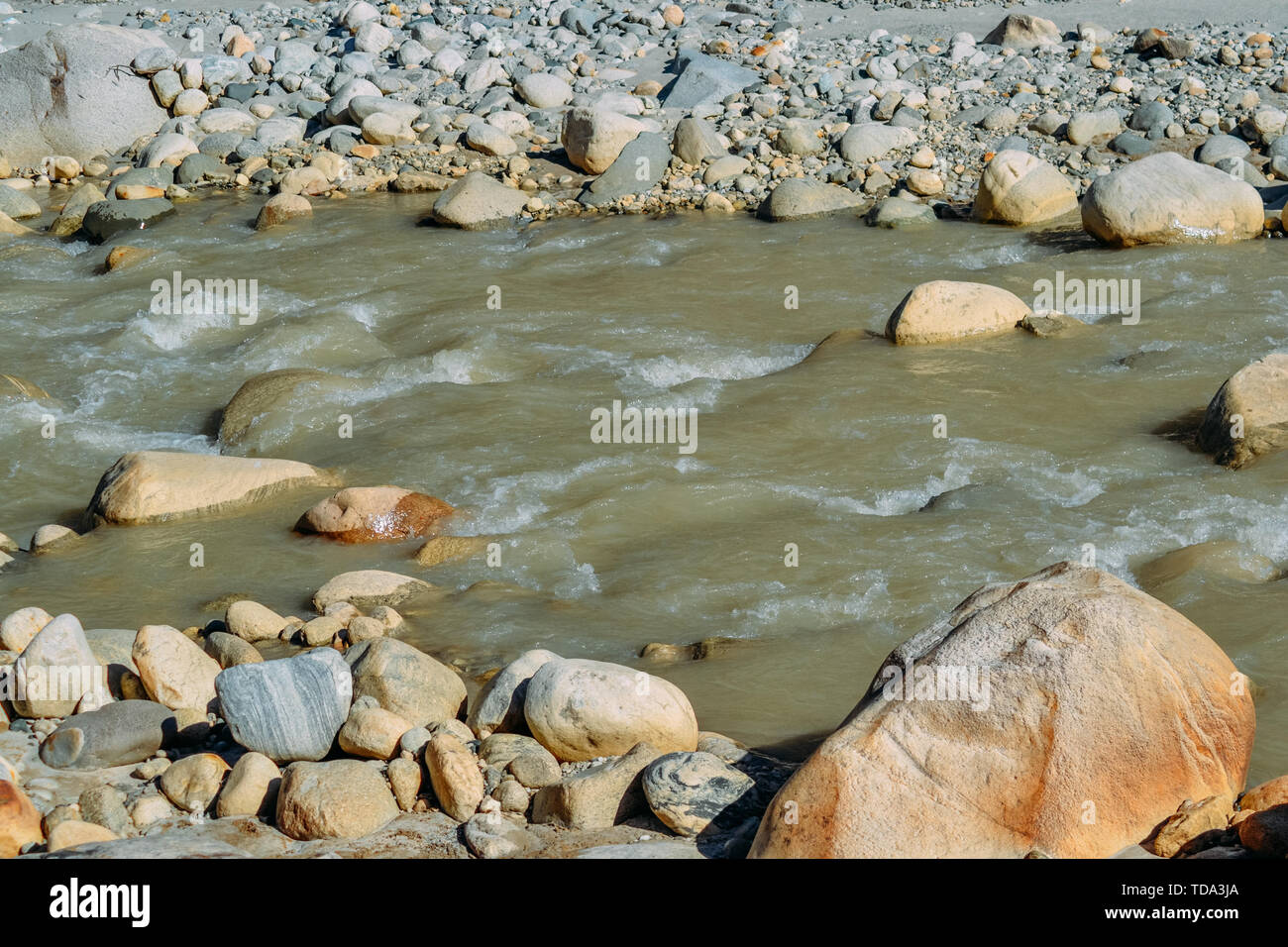 current of the river on mountain rocks in the daytime Stock Photo - Alamy