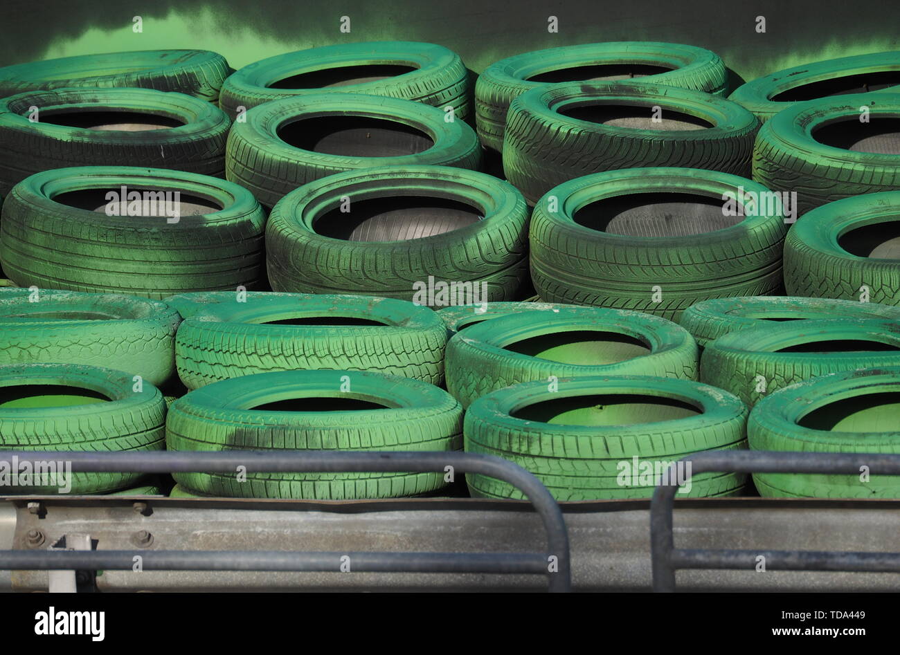 Green car tires, used for safety on Monza circuit Stock Photo - Alamy