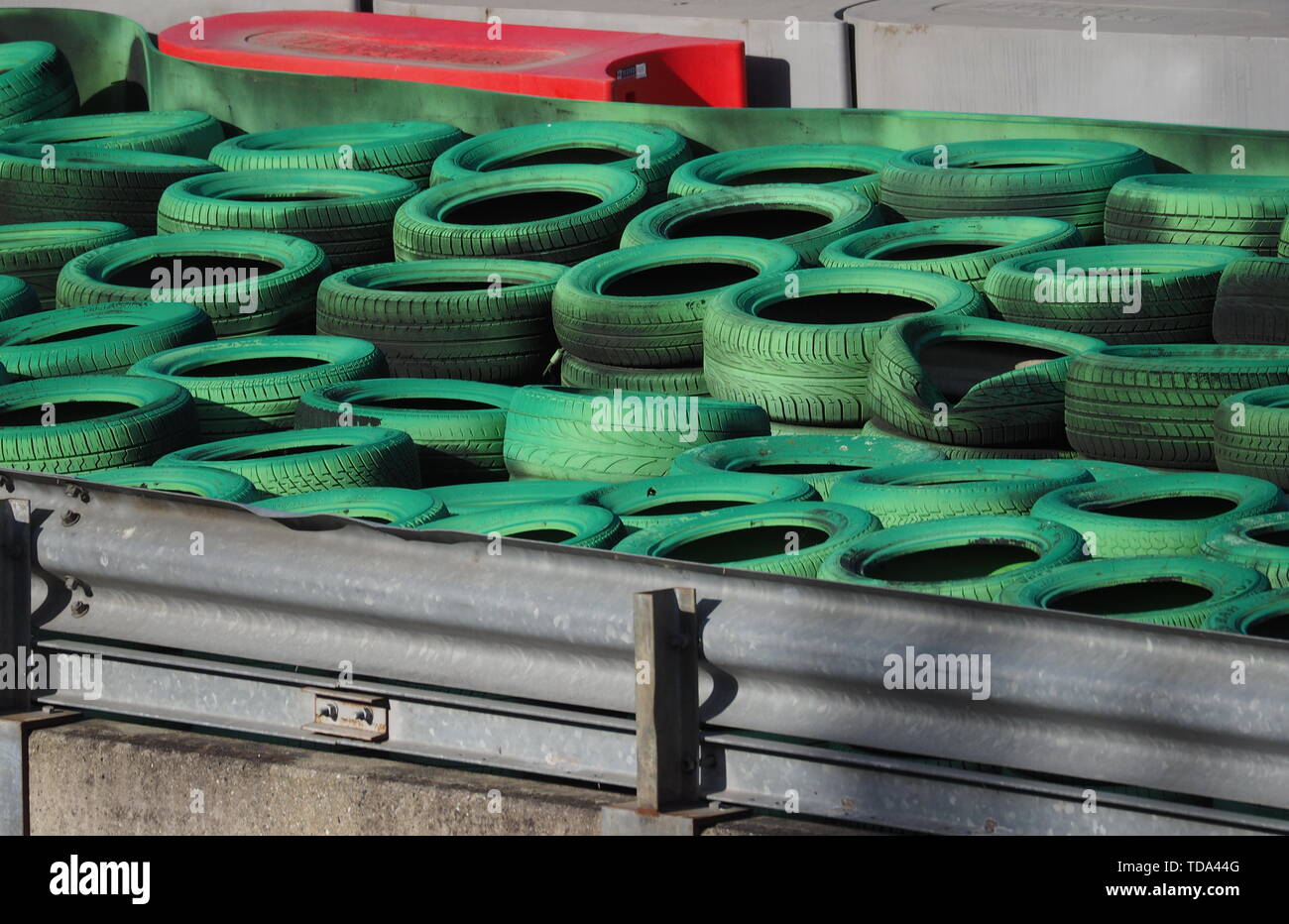 Green car tires, used for safety on Monza circuit Stock Photo - Alamy