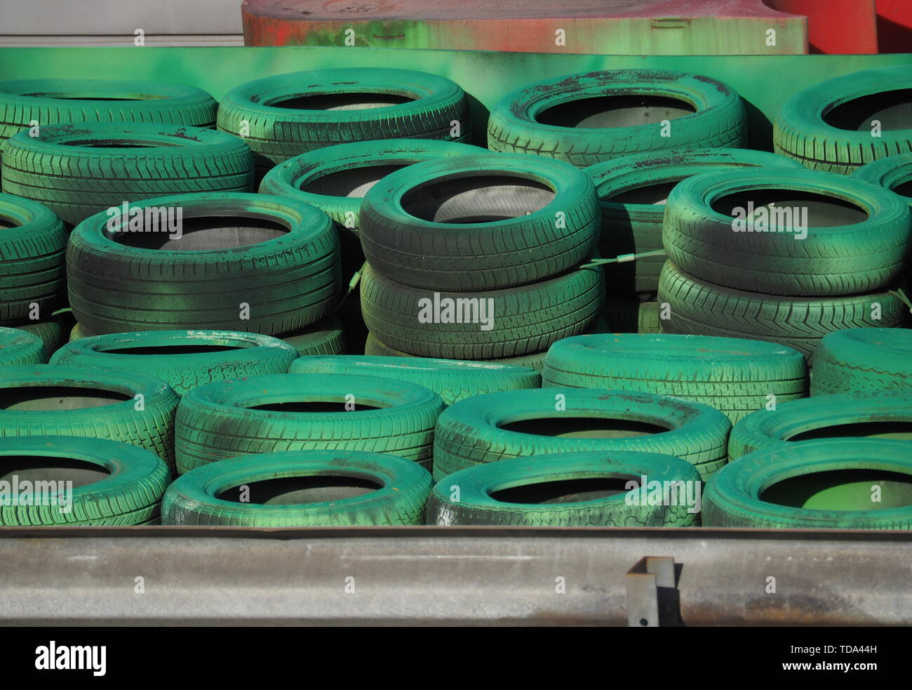 Green car tires, used for safety on Monza circuit Stock Photo - Alamy