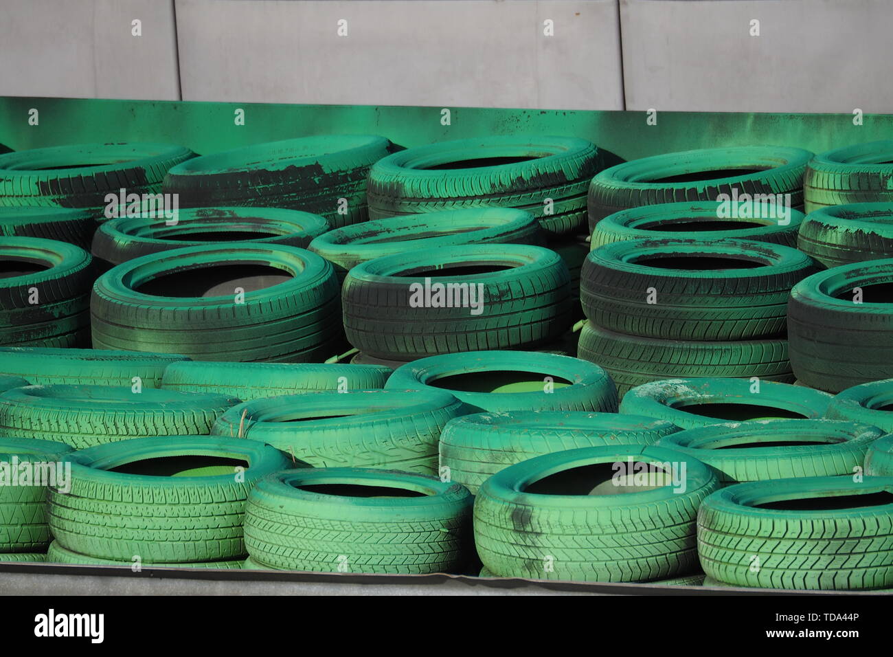 Green car tires, used for safety on Monza circuit Stock Photo - Alamy