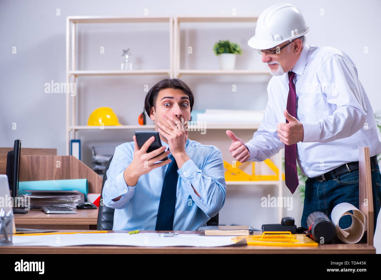 Two architects working on the project Stock Photo - Alamy