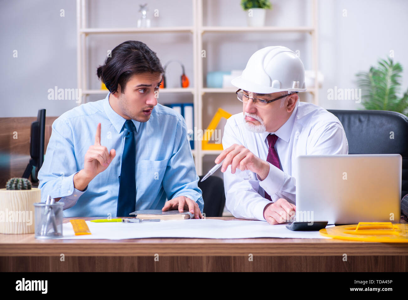 Two architects working on the project Stock Photo - Alamy