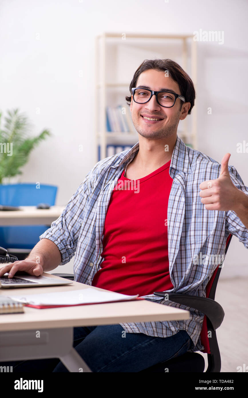 Male it specialist working in the office Stock Photo - Alamy