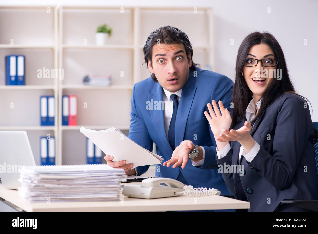 Two employees working in the office Stock Photo - Alamy