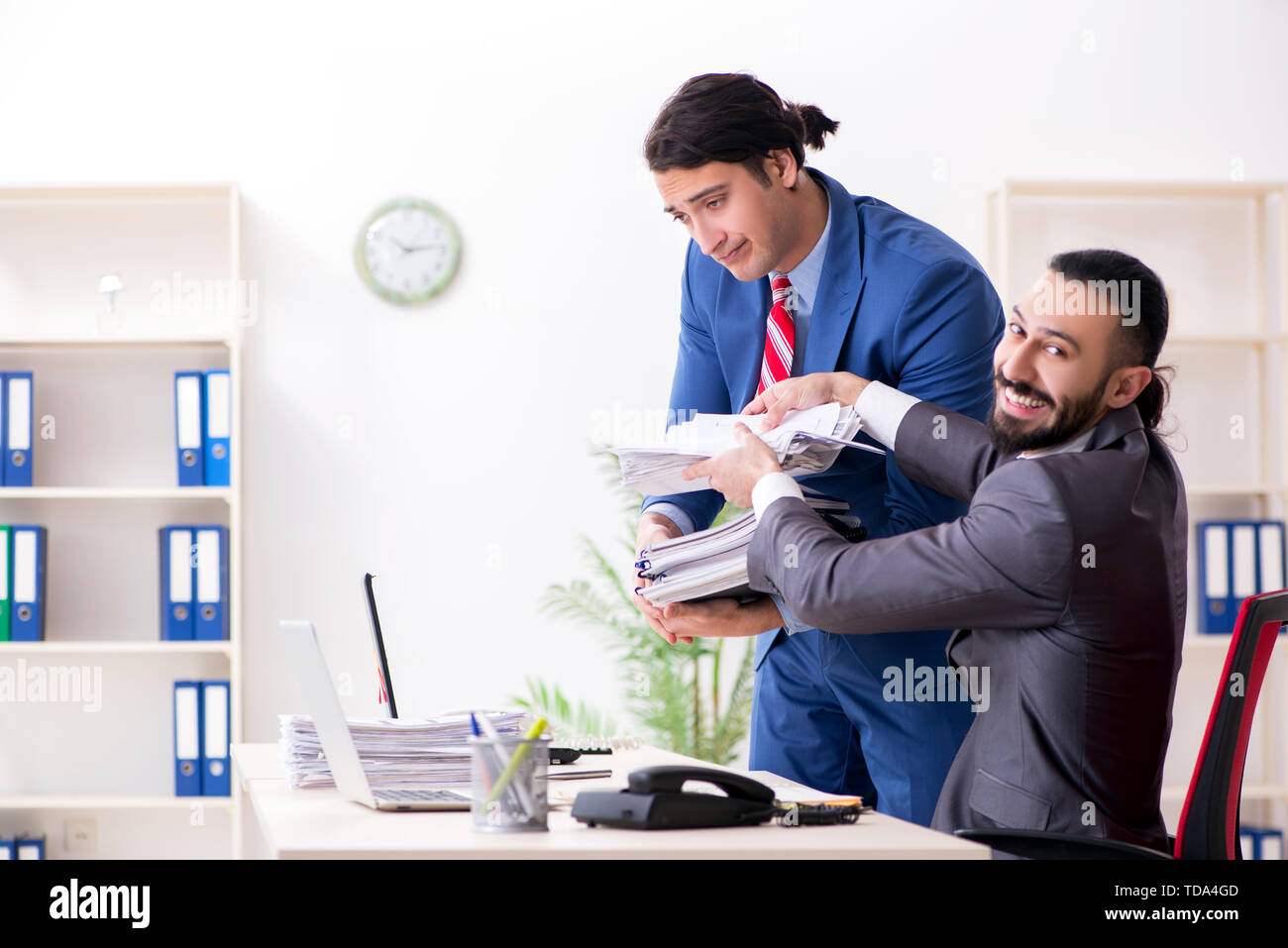 Two male colleagues in the office Stock Photo - Alamy