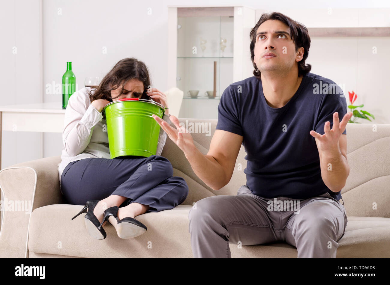 Young wife suffering from sick stomach and vomiting Stock Photo - Alamy