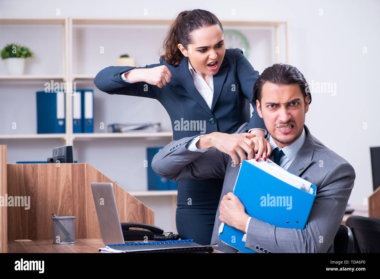 Woman fighting paperwork hi-res stock photography and images - Alamy