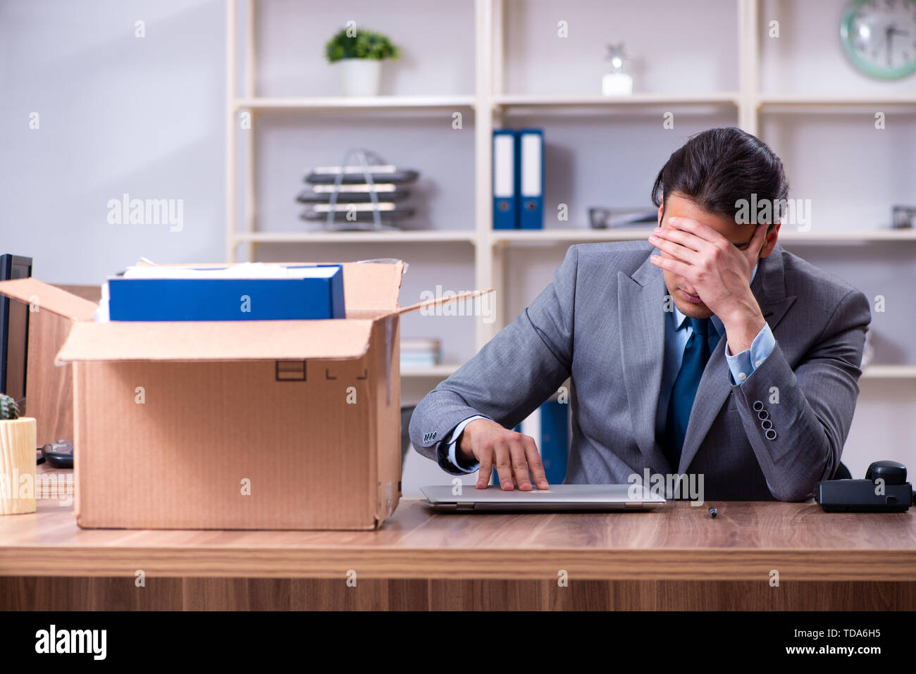 Young male employee being fired from his work Stock Photo - Alamy