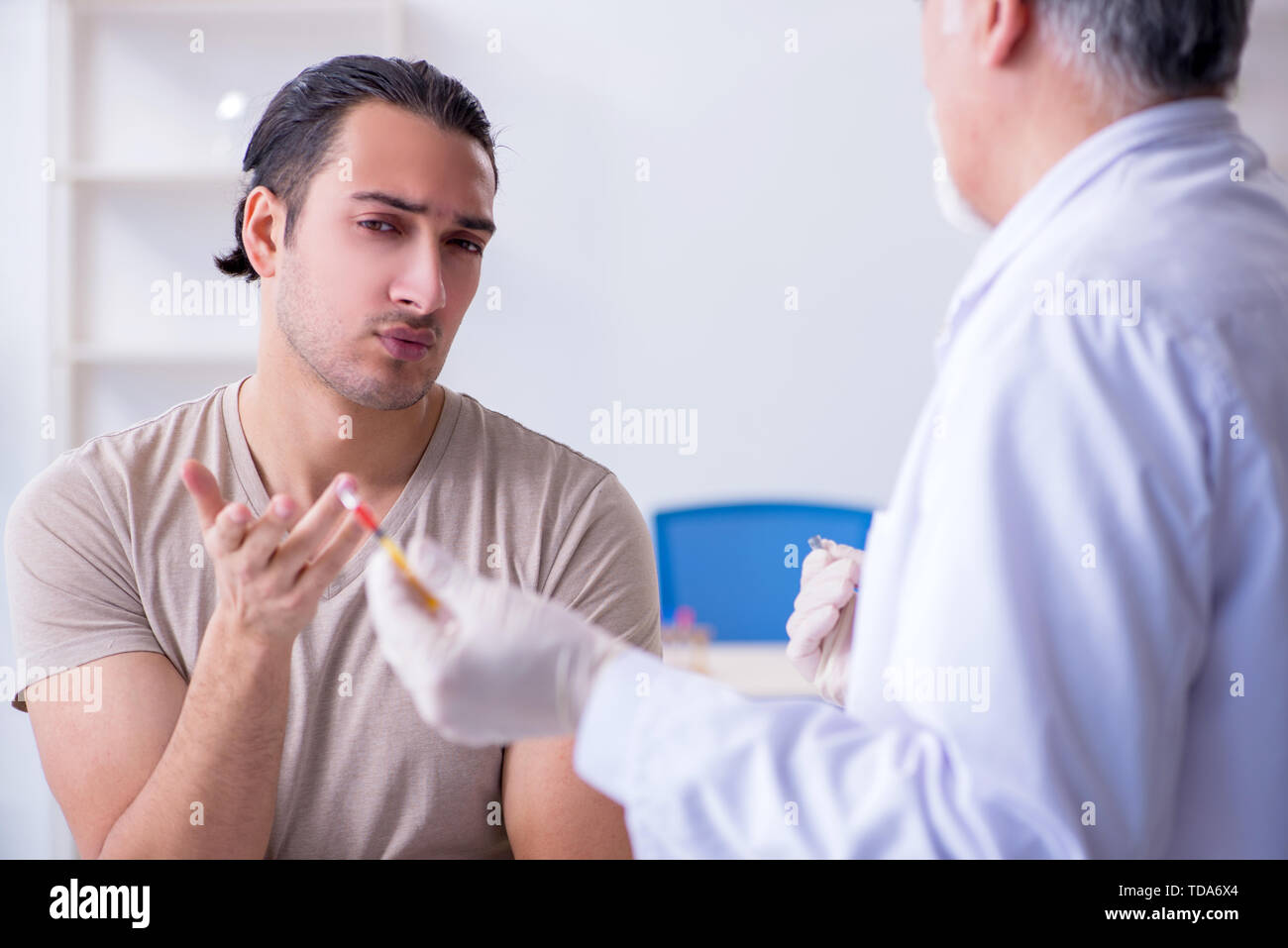 Male patient visitng doctor hi-res stock photography and images - Alamy