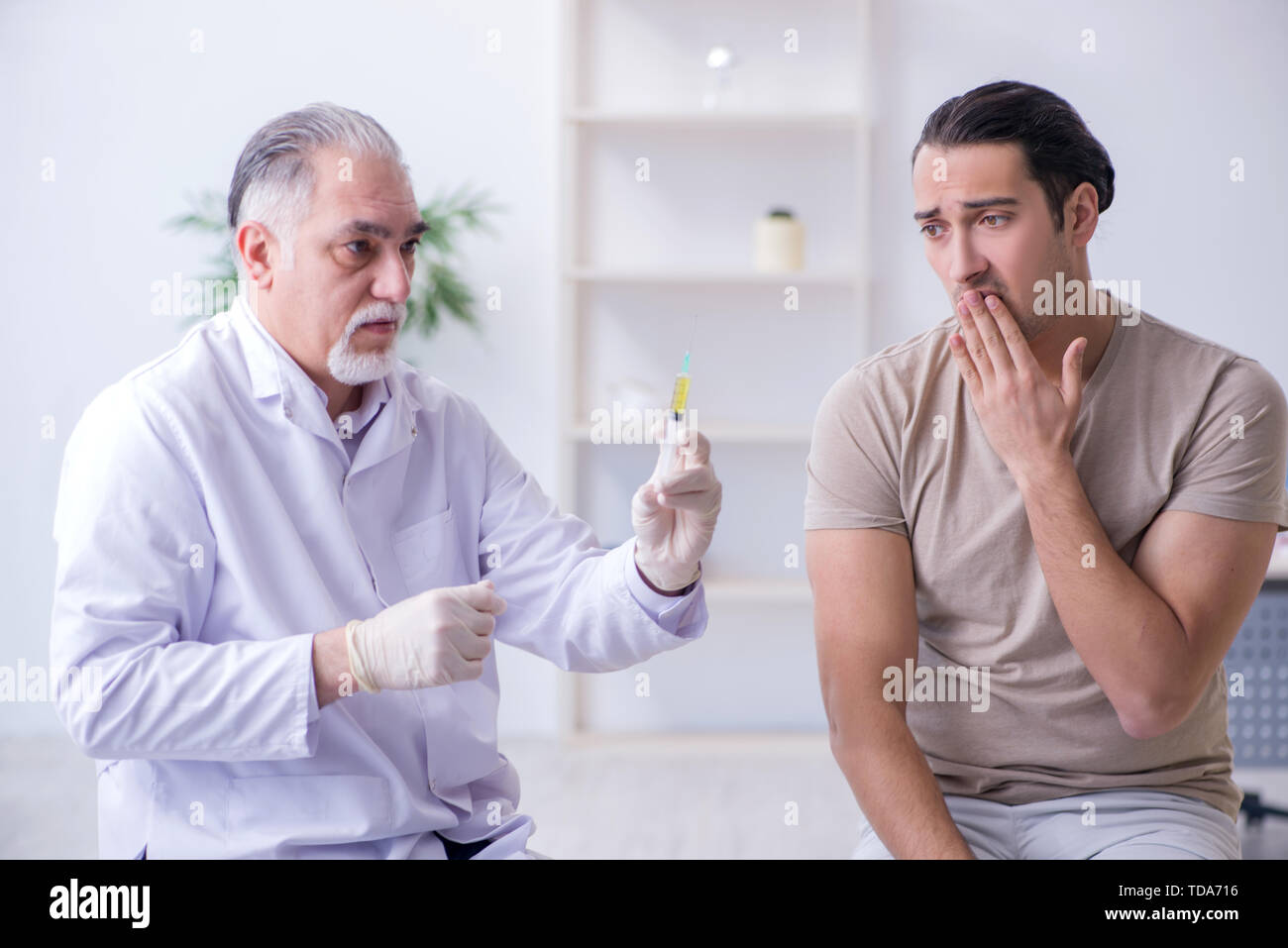 Male patient visitng doctor hi-res stock photography and images - Alamy