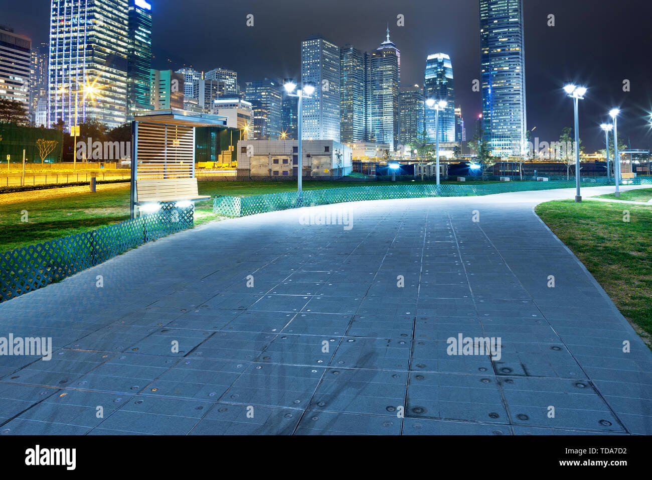 pathway in the night with modern city background Stock Photo - Alamy