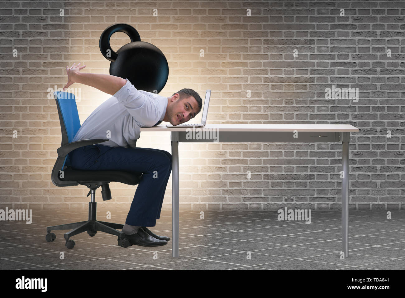 Employee with burden of work Stock Photo - Alamy