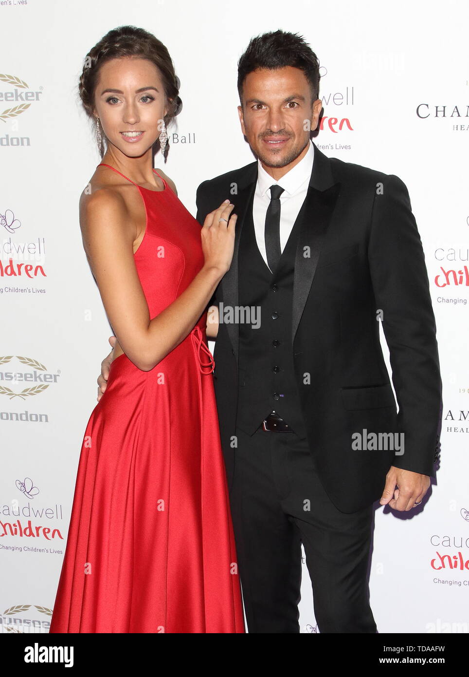 London, UK. 13th June, 2019. Peter Andre and Emily Andre arrive for the Caudwell Children ...