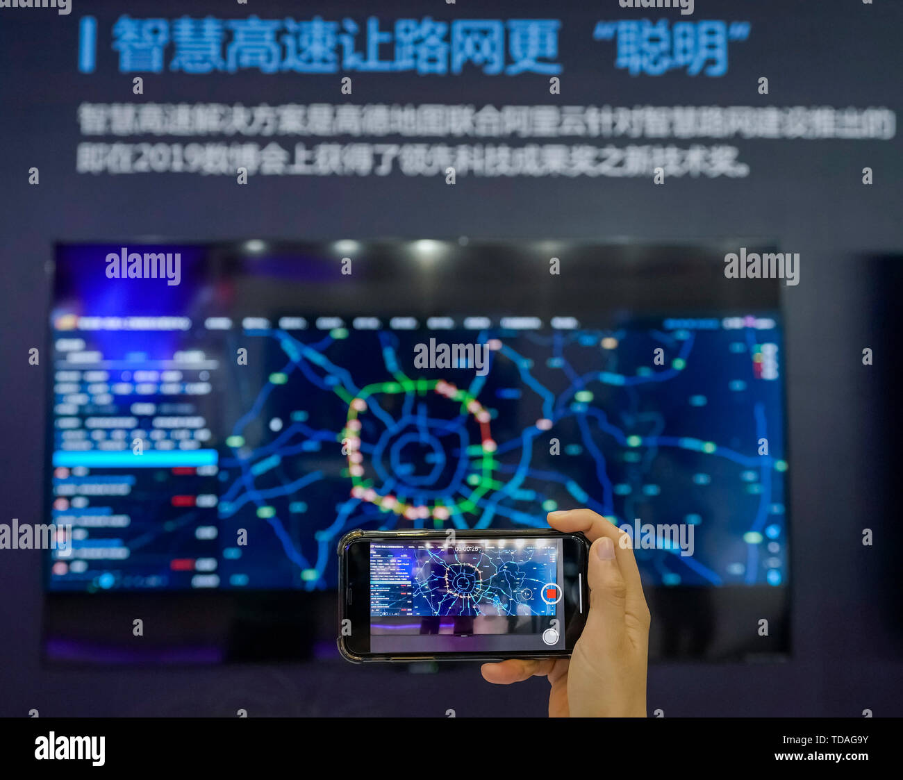 Beijing, China. 14th June, 2019. A visitor takes a picture of a smart ...
