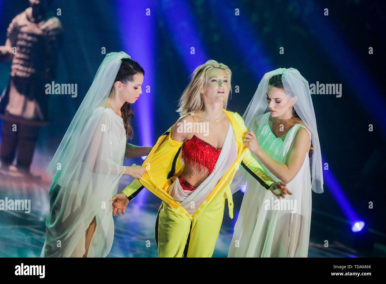 Cologne, Germany. 14th June, 2019. Ella Endlich, singer, is helped by ...