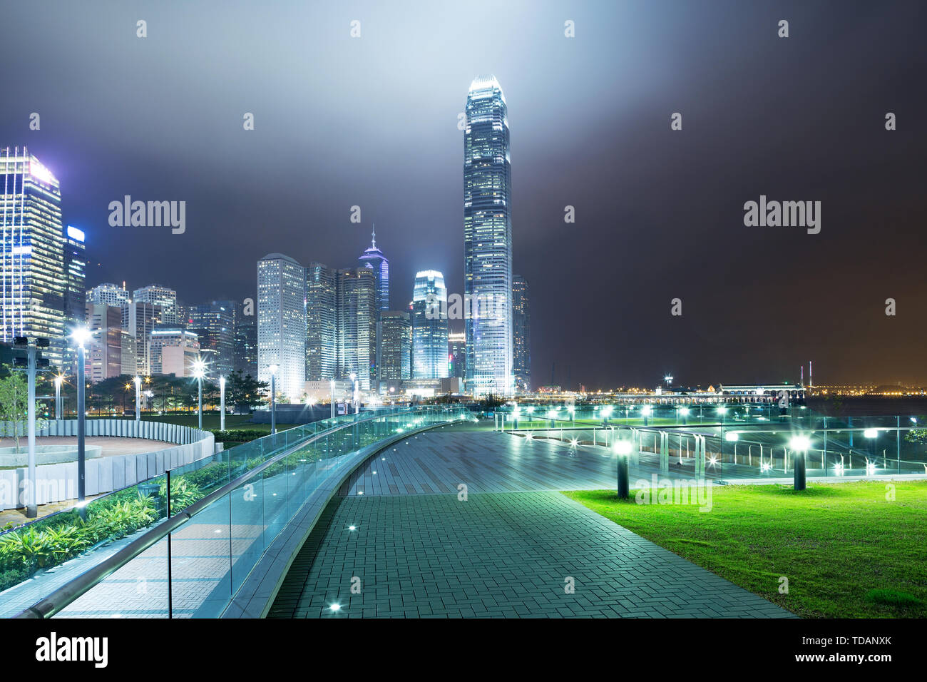 pathway in the night with modern city background Stock Photo - Alamy