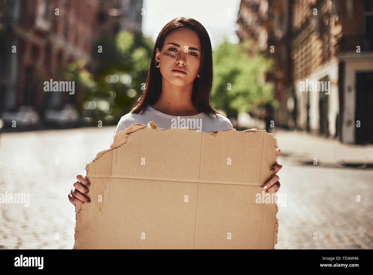 Strong and free. Young woman with word freedom written on her body ...