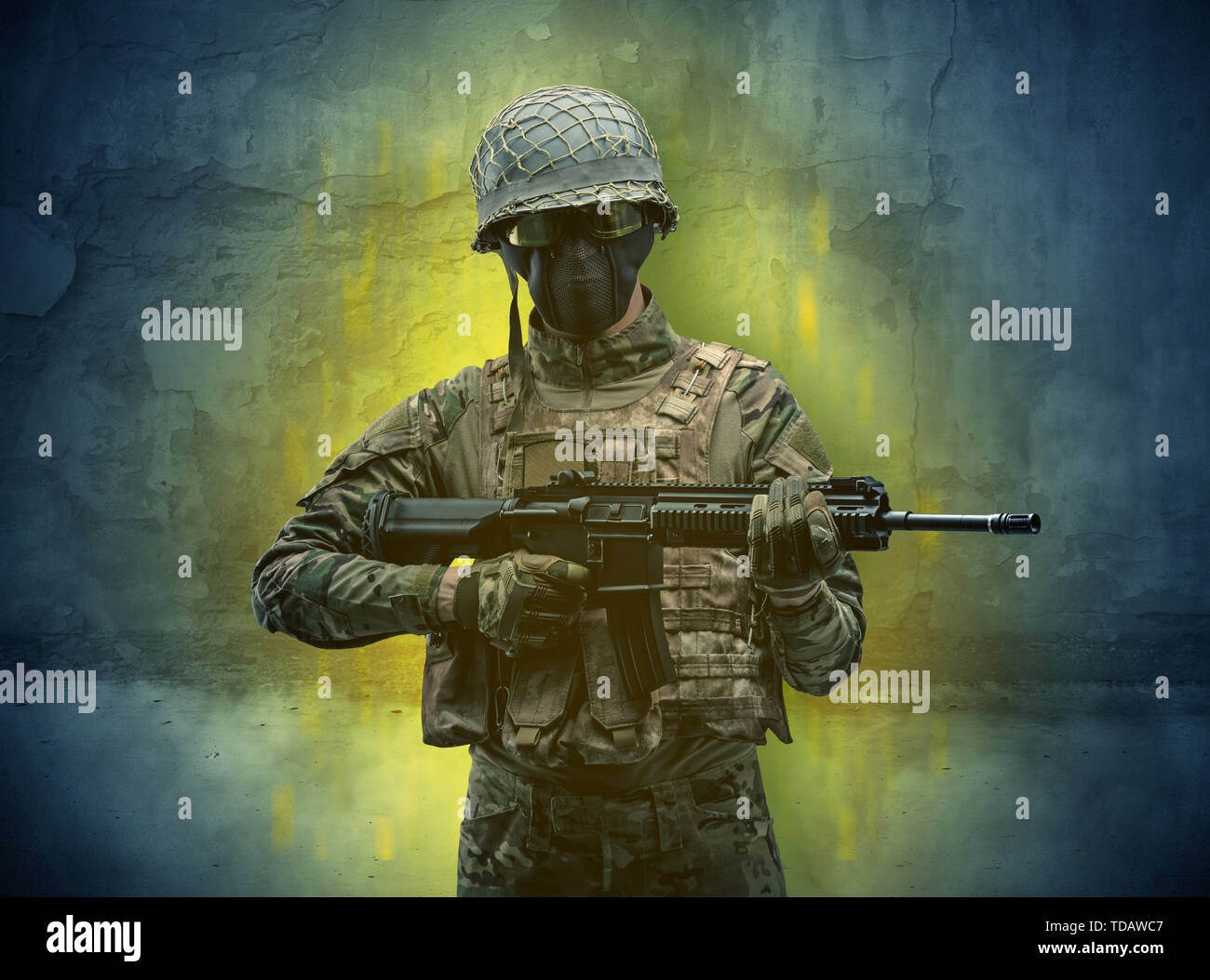 Hazard, menace soldier in a ruined crumbly building with arms on his ...