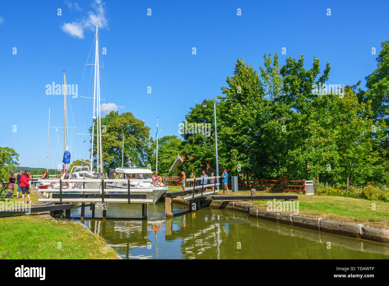 Lock gates that open to the boats Stock Photo - Alamy