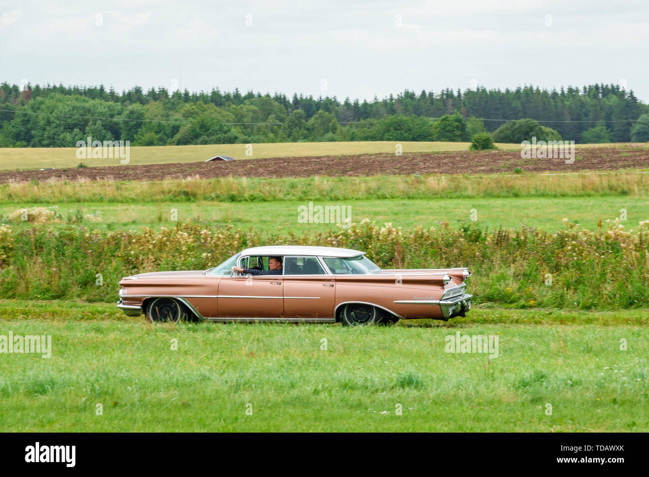 Old american classic car driving in the countryside Stock Photo - Alamy