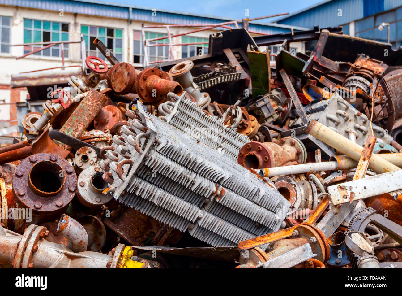 Pile of scrap metal, old cooling system and industrial parts, pipes and ...