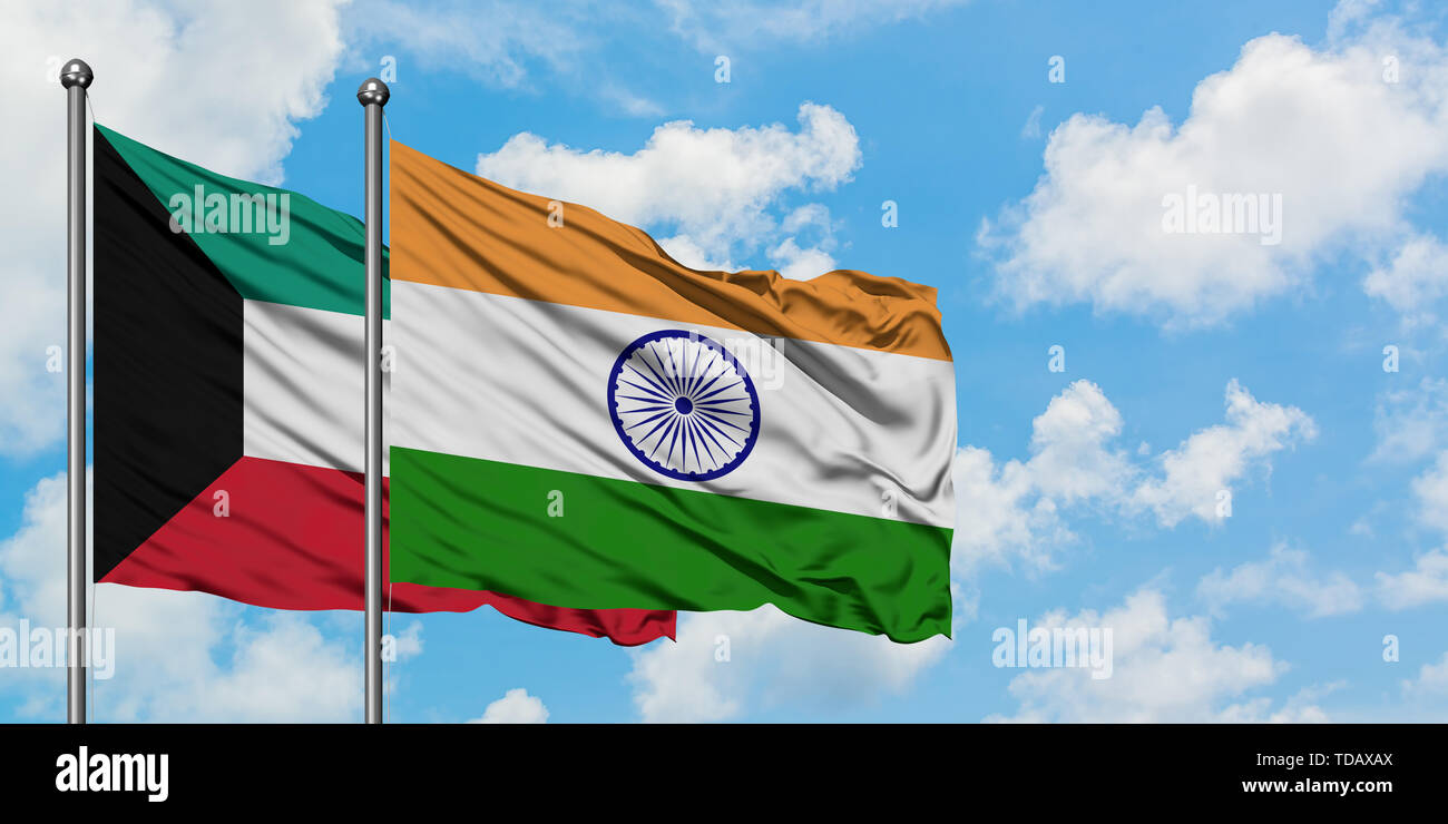 Kuwait and India flag waving in the wind against white cloudy blue sky ...