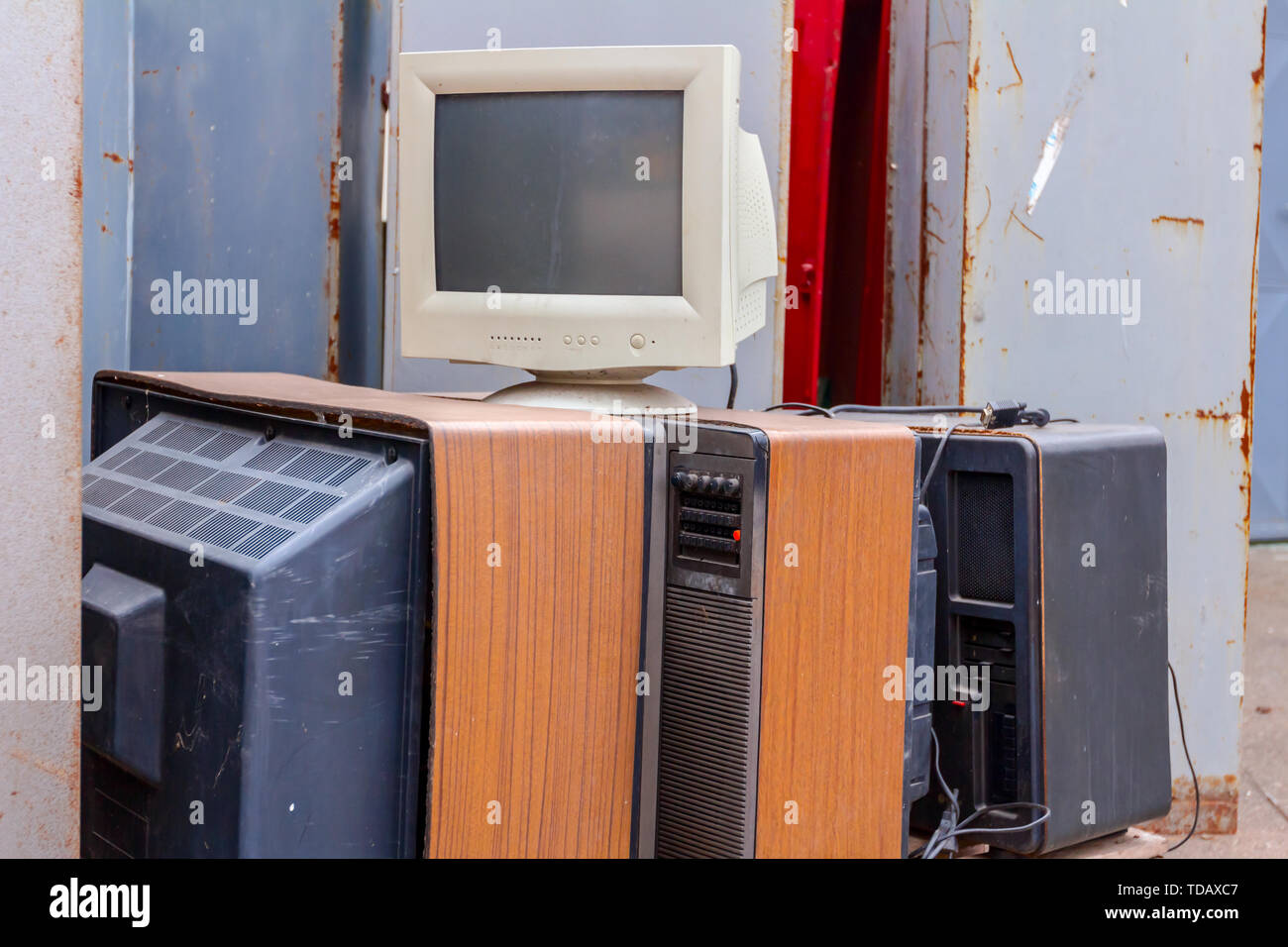 Piled up several retro, old vintage TV and one PC display, they are ...