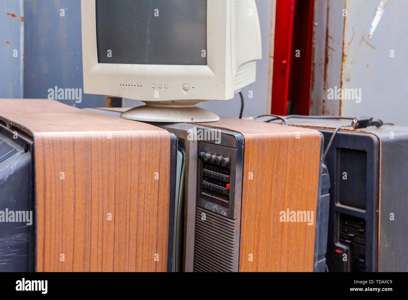 Piled up several retro, old vintage TV and one PC display, they are ...