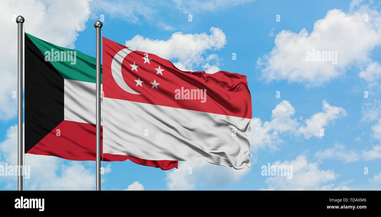 Kuwait and Singapore flag waving in the wind against white cloudy blue ...