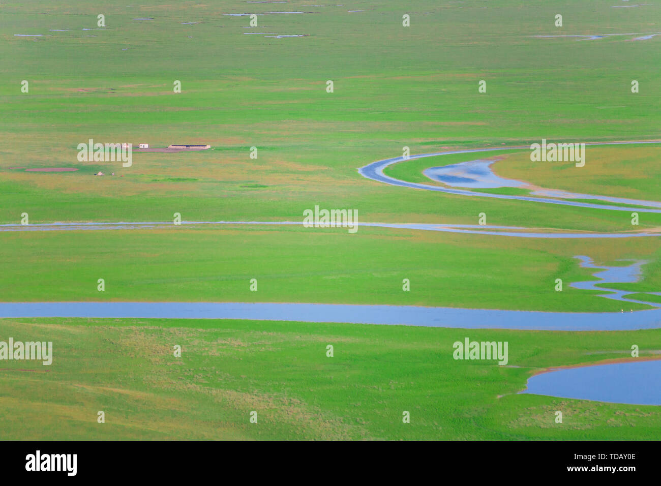 In the middle of summer, the Kaidu River winds through the Bayinbrook ...