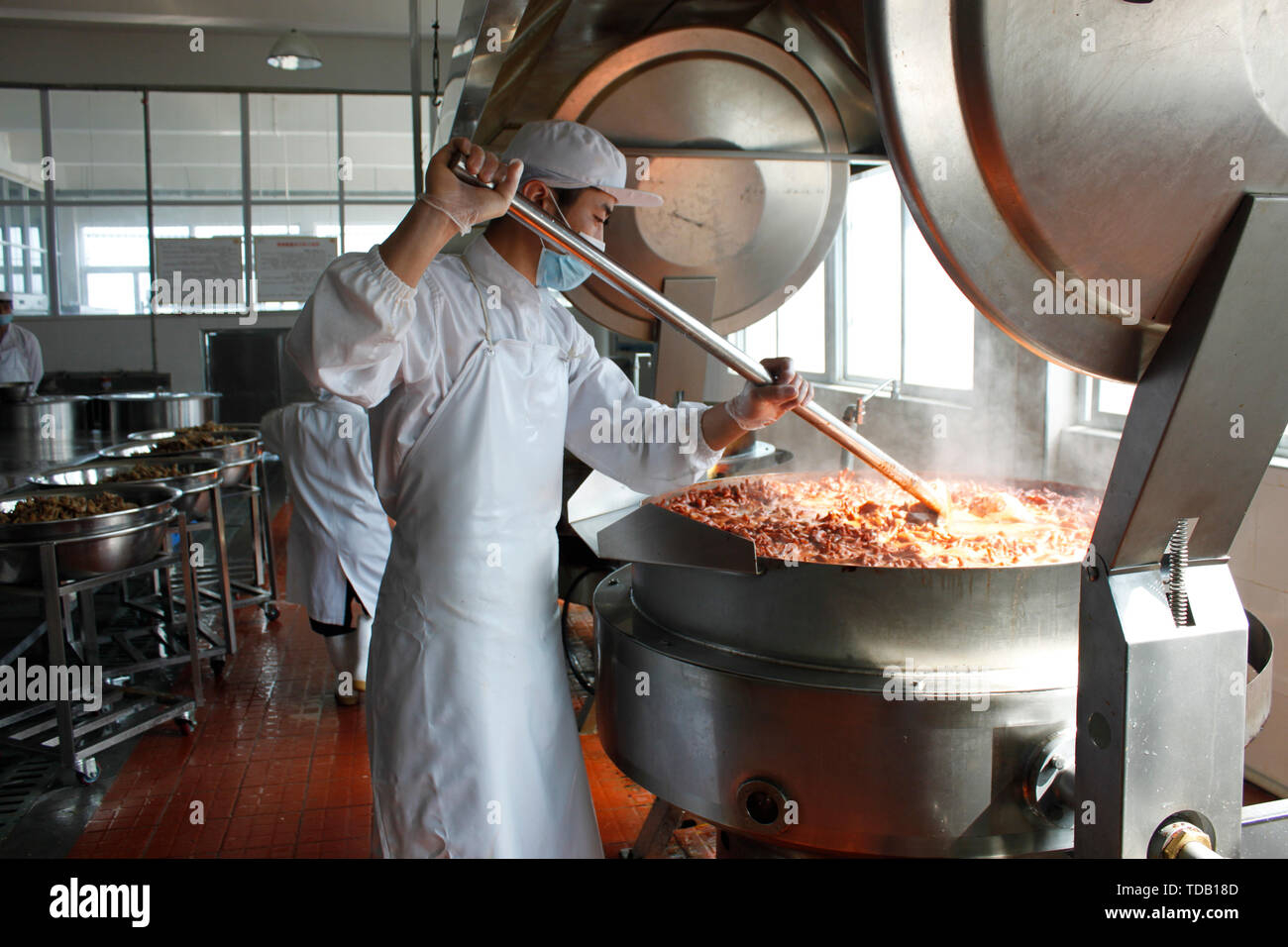 Food stir-frying processing Stock Photo - Alamy
