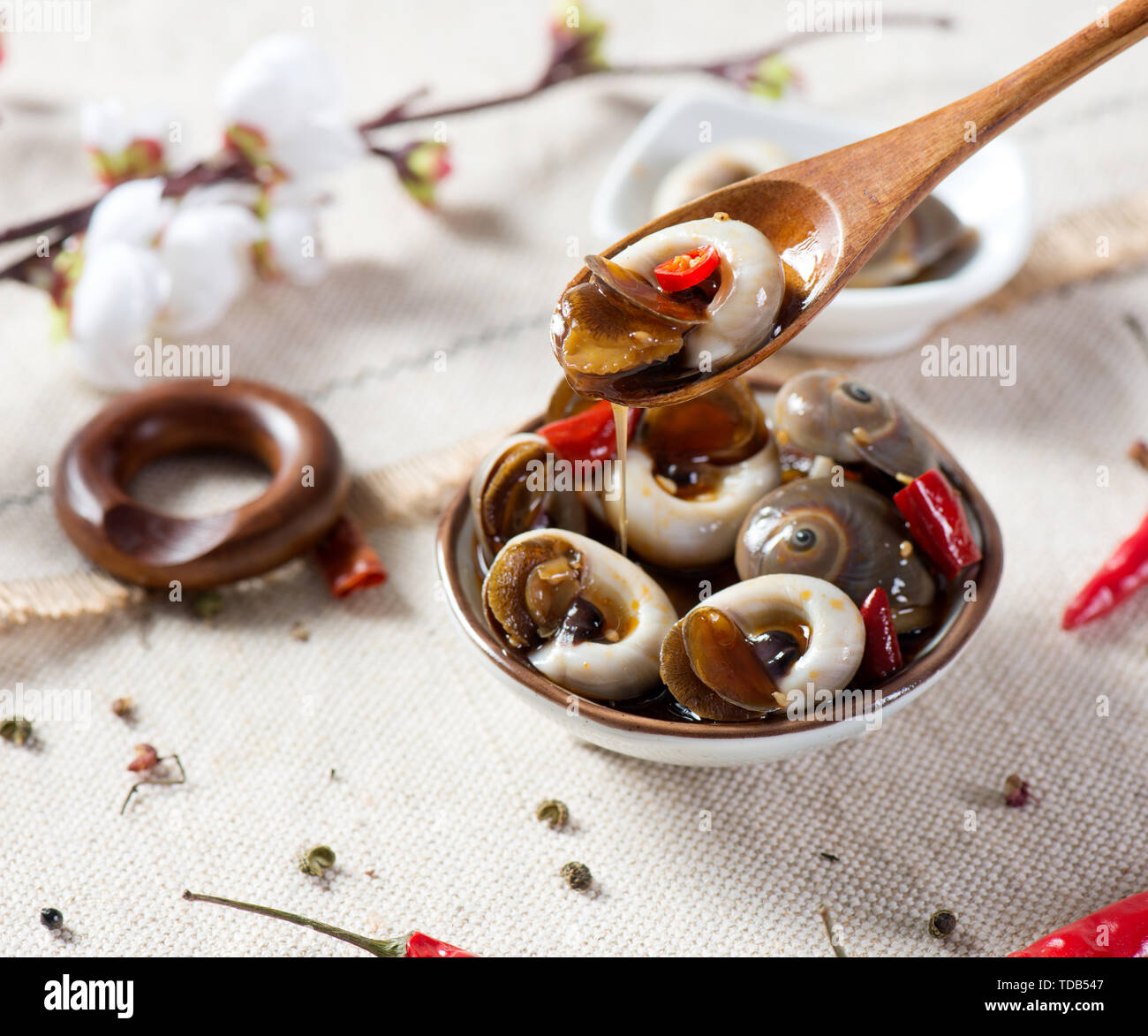 Spicy little seafood snail Stock Photo - Alamy