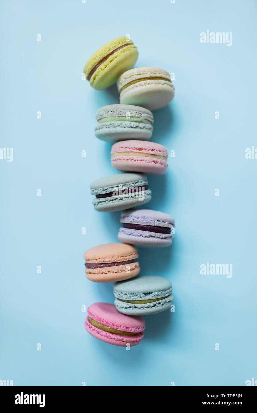 Cake macaron or macaroon on pastel blue background from above. Colorful ...
