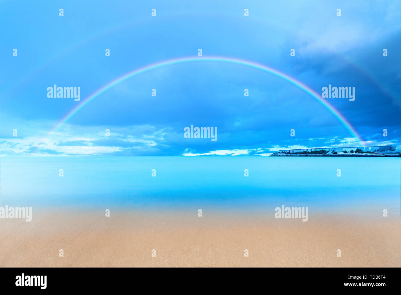 Rainbow at sea Stock Photo - Alamy