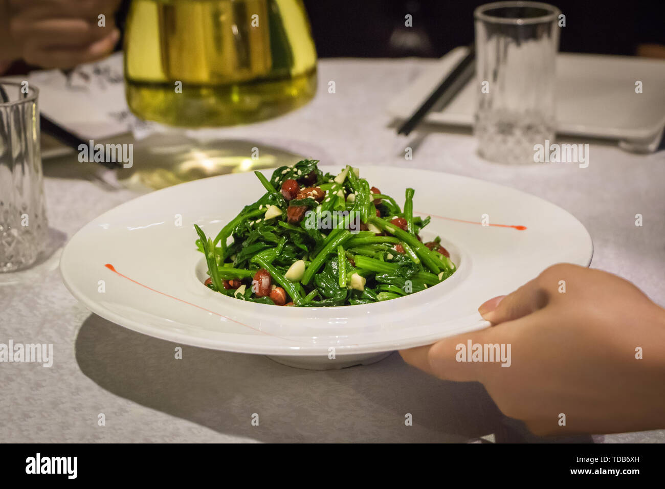 Chinese food, nuts, spinach Stock Photo - Alamy