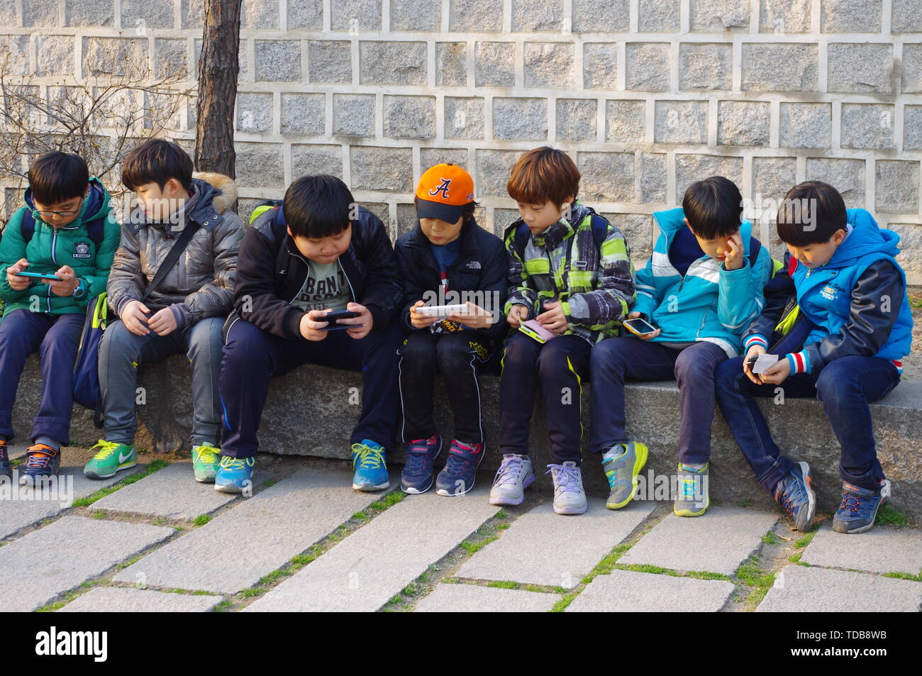 Boy playing mobile game Stock Photo - Alamy