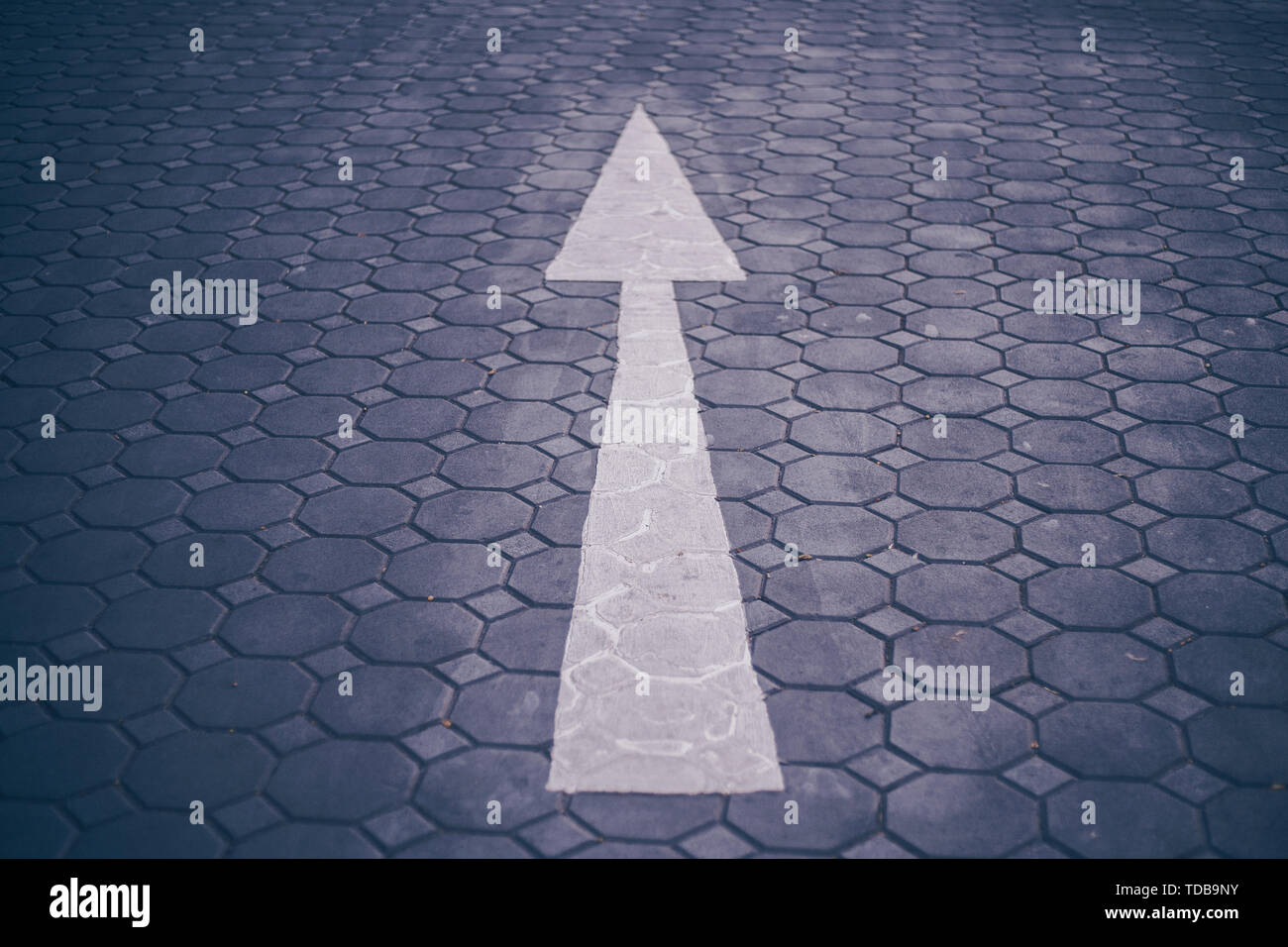 Asphalt road with an arrow up. Up arrow on gray background Stock Photo ...