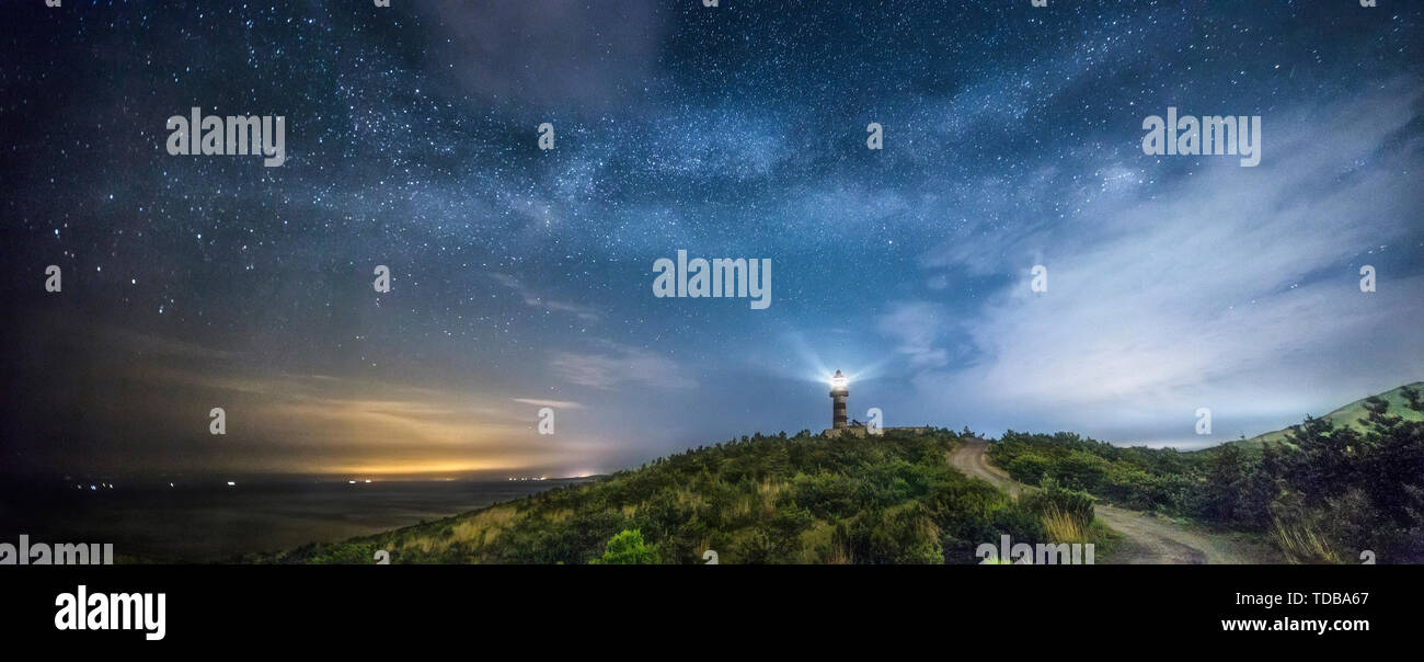 Lighthouse under the stars Stock Photo - Alamy