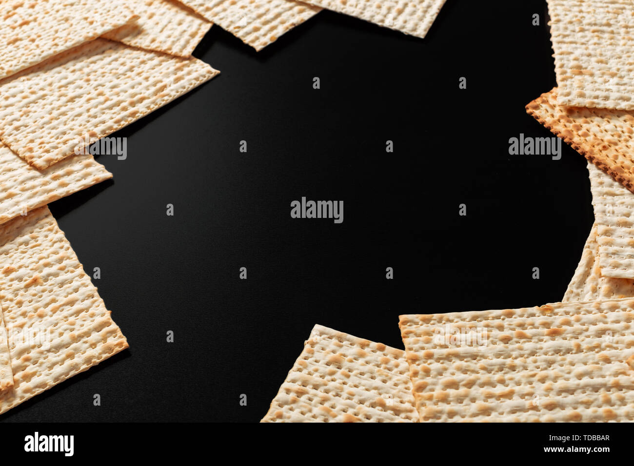 A photo of matzah or matza pieces on black background. Matzah for the ...