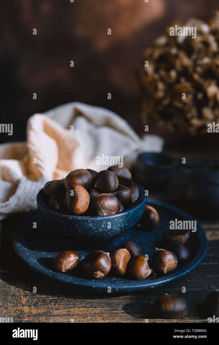 Piles of stir-fried chestnuts Stock Photo - Alamy